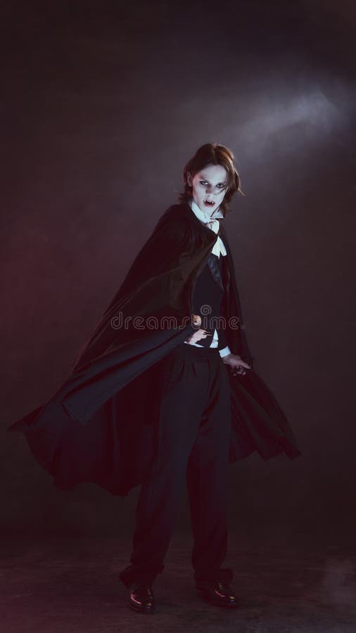 Man in Black Cape and Suit. Looks Terrified, As Vampire Gazes Forward ...