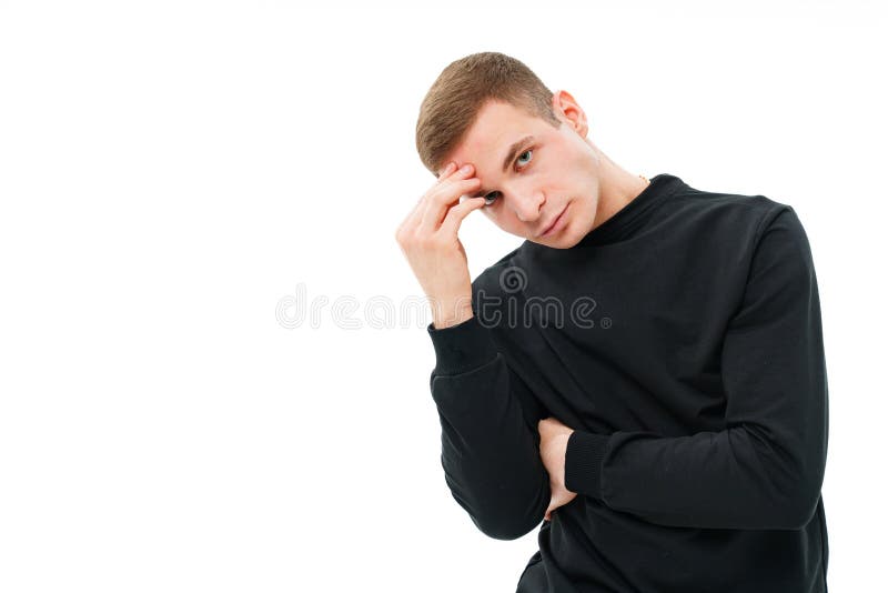 A Man in Black Clothes Holds on To Head in the Pose of a Thinker on a ...