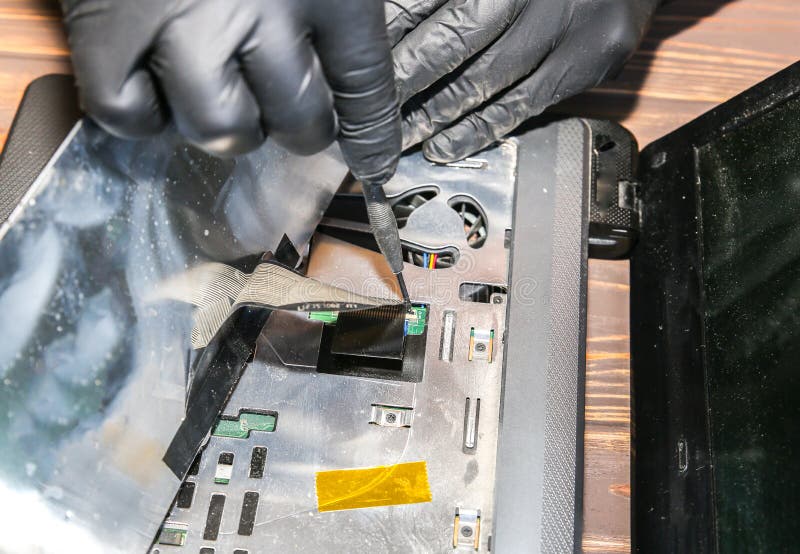 Man in Black Gloves is Repairing a Laptop. Service Center Worker Fixing ...