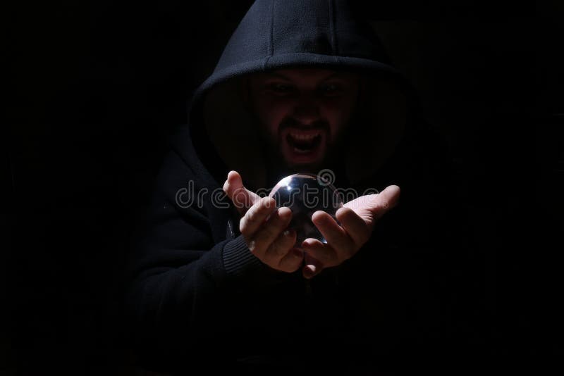 Man in a Black Hood with Cristal Ball Stock Photo - Image of mature ...