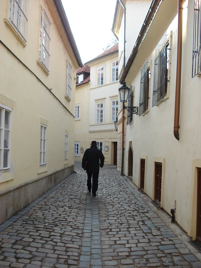 Man in Black Roaming the Streets If Prague Stock Photo - Image of ...