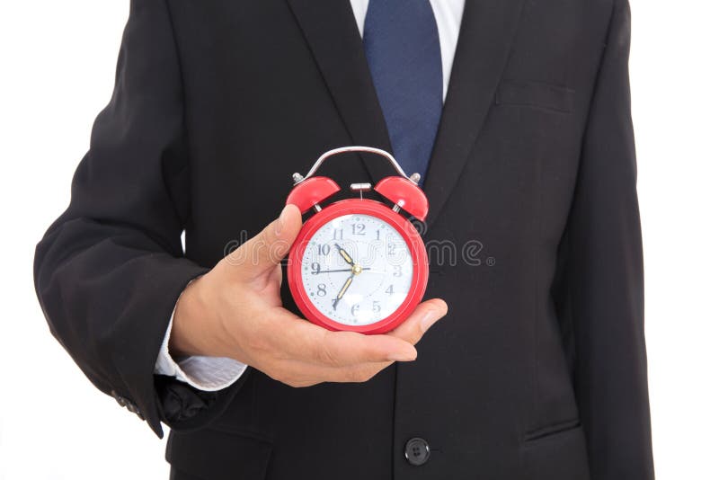Man In Black Suit Holding Alarm Clock In Hand Stock Image Image Of