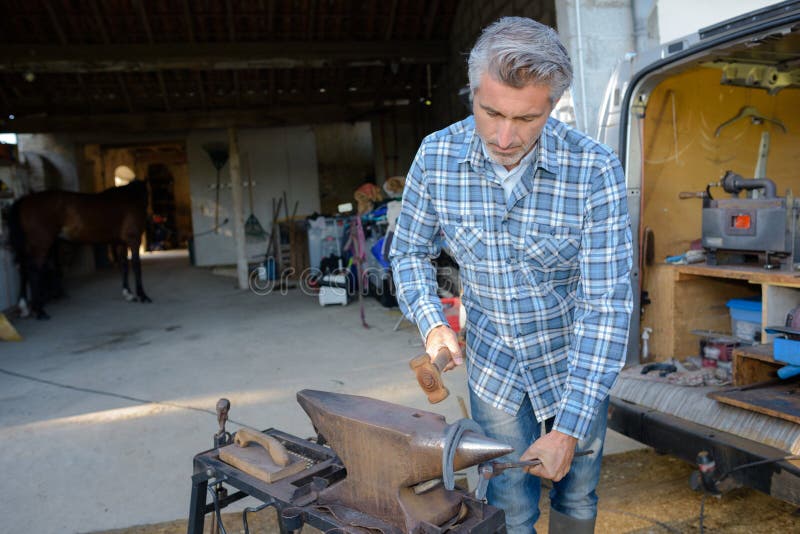 Man Blacksmith Shaping Horseshoe Stock Image - Image of bevel, farrier ...