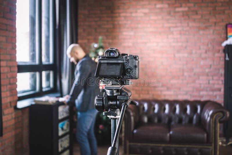 Man Blogger Prepares To Record Himself on Video Blog on the Camera in ...