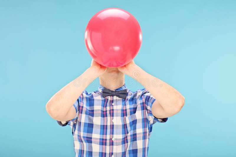 Man Blowing Up Balloon Blue Background Stock Photos - Free & Royalty ...