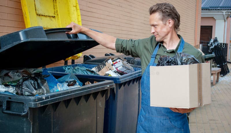 Man in Blue Apron Holds Paper Box before Taking Out into Container for ...