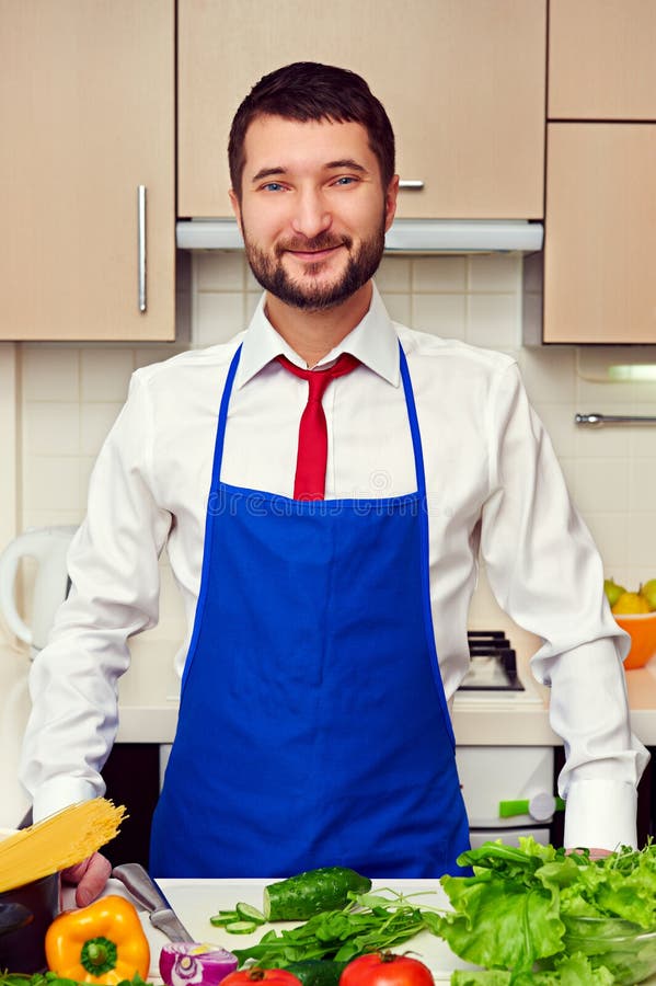 Man in Blue Apron in the Kitchen Stock Image - Image of healthy, happy ...