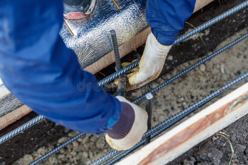 A Man in a Blue Jacket is Working on a Construction Site Stock Image ...