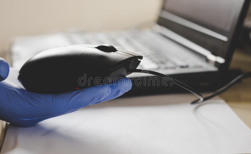 A Man in Blue Rubber Gloves Holds a Computer Mouse, Stock Image - Image ...