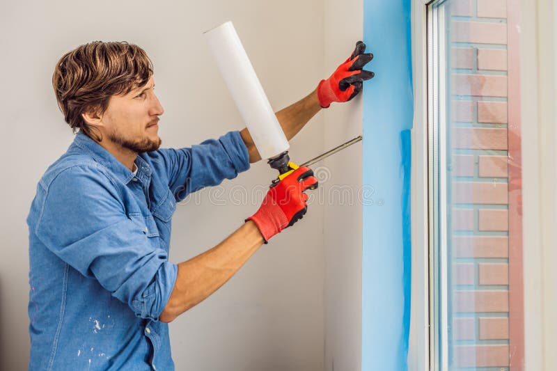 Man in a Blue Shirt Does Window Installation Stock Image - Image of ...