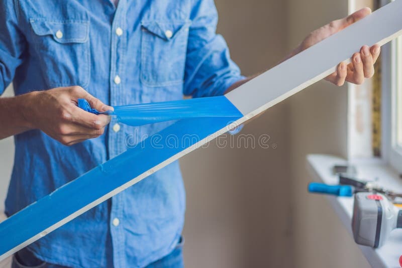 Man in a Blue Shirt Does Window Installation Stock Image - Image of ...