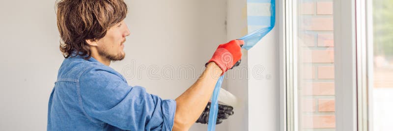 Man in a Blue Shirt Does Window Installation BANNER, LONG FORMAT Stock ...