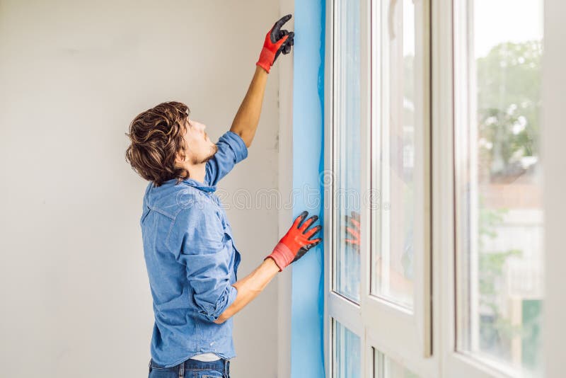 Man in a Blue Shirt Does Window Installation Stock Photo - Image of ...