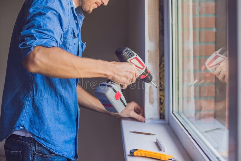 Handyman Fixing the Window with Screwdriver Stock Photo - Image of ...
