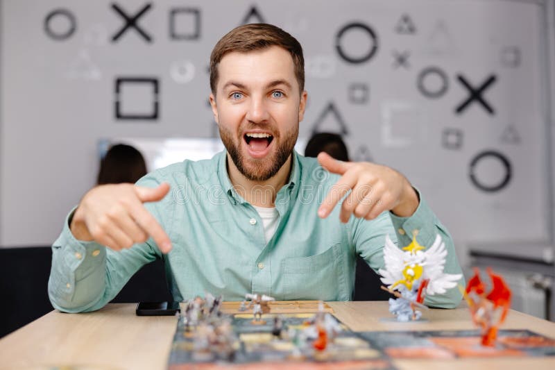 Man with Board Game Piece while Practicing Strategy in Home Alone Stock ...