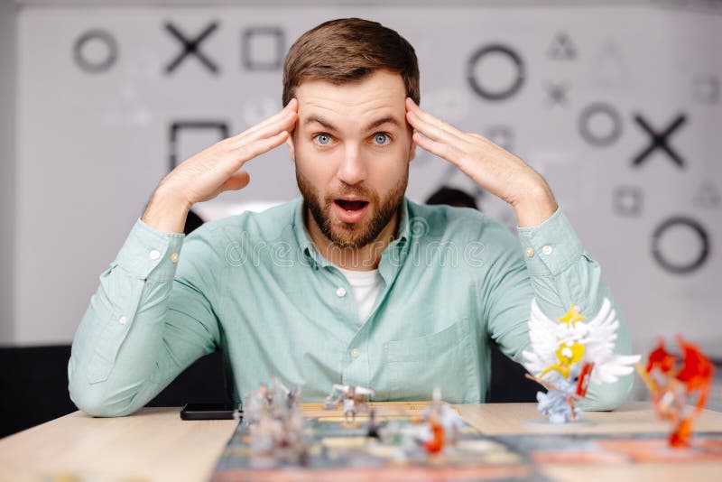 Man with Board Game Piece while Practicing Strategy in Home Alone. a ...
