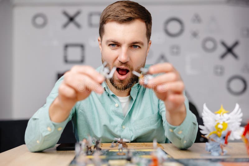 Man with Board Game Piece while Practicing Strategy in Home Alone. a ...