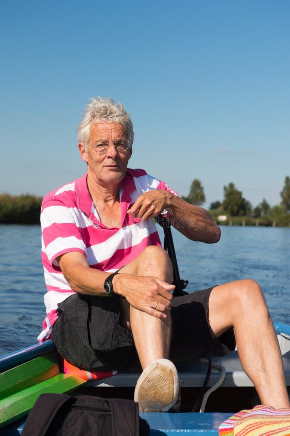 Man in boat at the river stock photo. Image of netherlands - 33487318