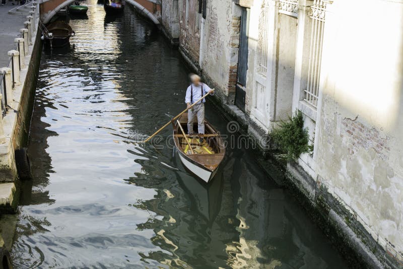 Man on a boat in Venice editorial photo. Image of historic - 41781616