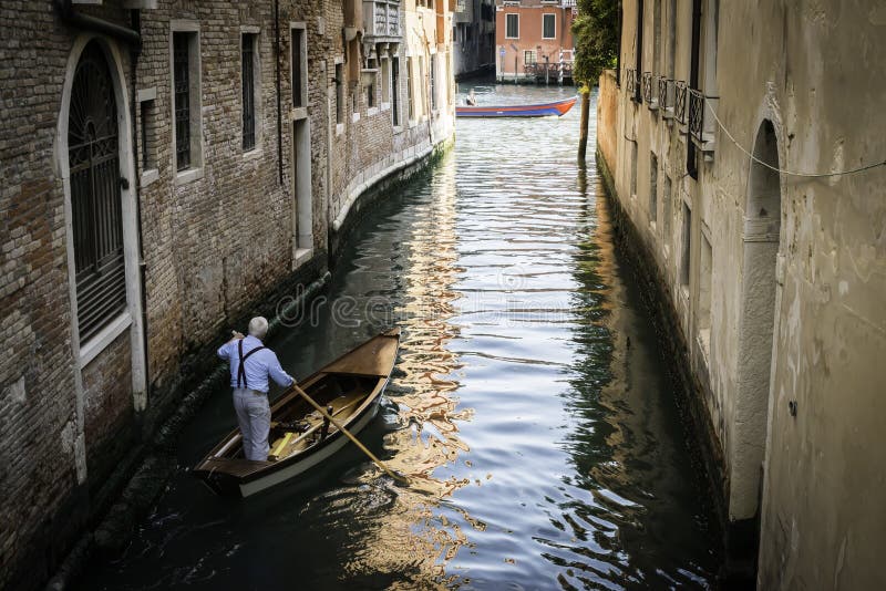 Man on a boat in Venice editorial photo. Image of historic - 41781616