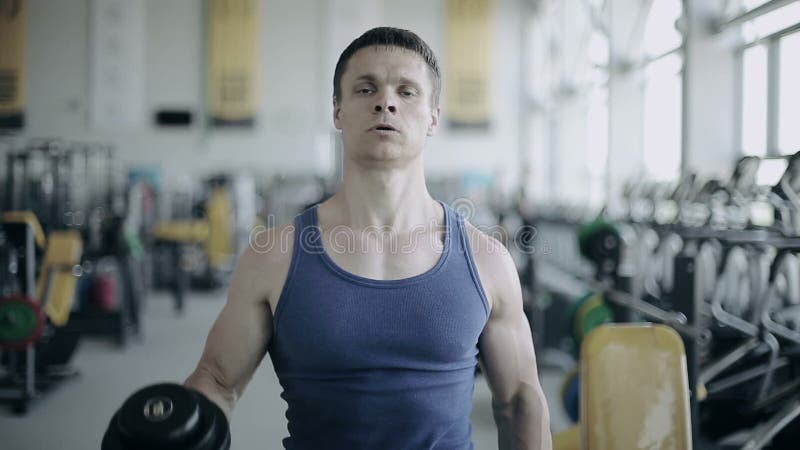 Man Bodybuilder Execute Exercise with Dumbbells in Gym. No Face Stock ...