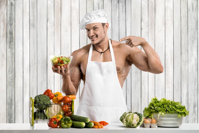 Man bodybuilder on kitchen stock photo. Image of food - 132744378