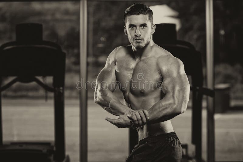Man Bodybuilder Performing Side Chest Pose Stock Photo - Image of ...
