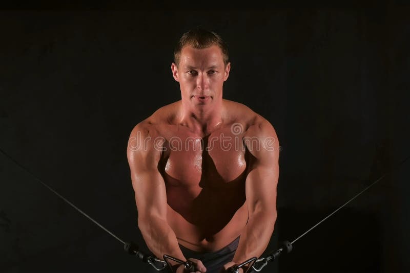 Man Bodybuilder Training Chest Muscles Exercise Using Cable Crossover ...