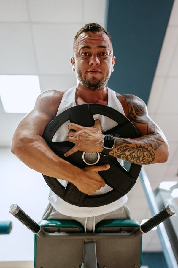Man Bodybuilder in White Shirt Training in a Gym Portrait Stock Image ...