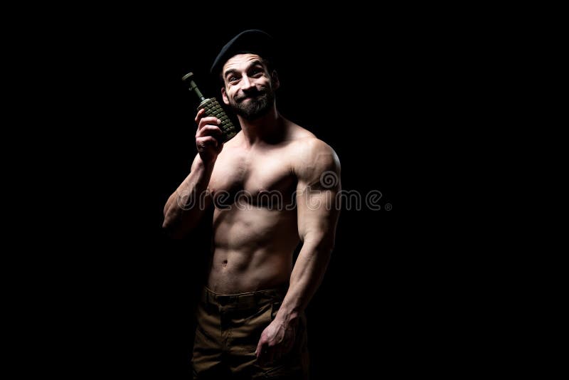 Young Man Holding a Bomb on Black Background Stock Photo - Image of ...
