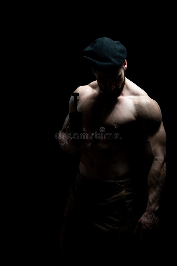 Young Man Holding a Bomb on Black Background Stock Photo - Image of ...