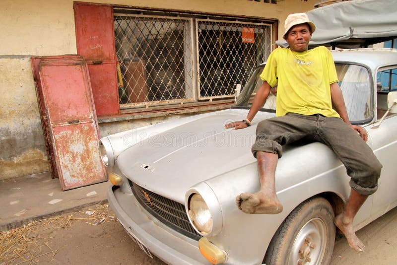 Man on the bonnet editorial stock photo. Image of door - 28273723