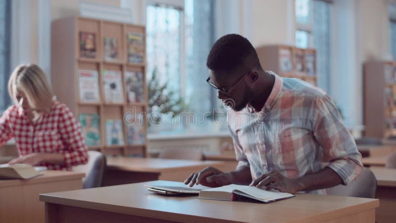 Man with Book Looking at Camera Stock Image - Image of racial ...