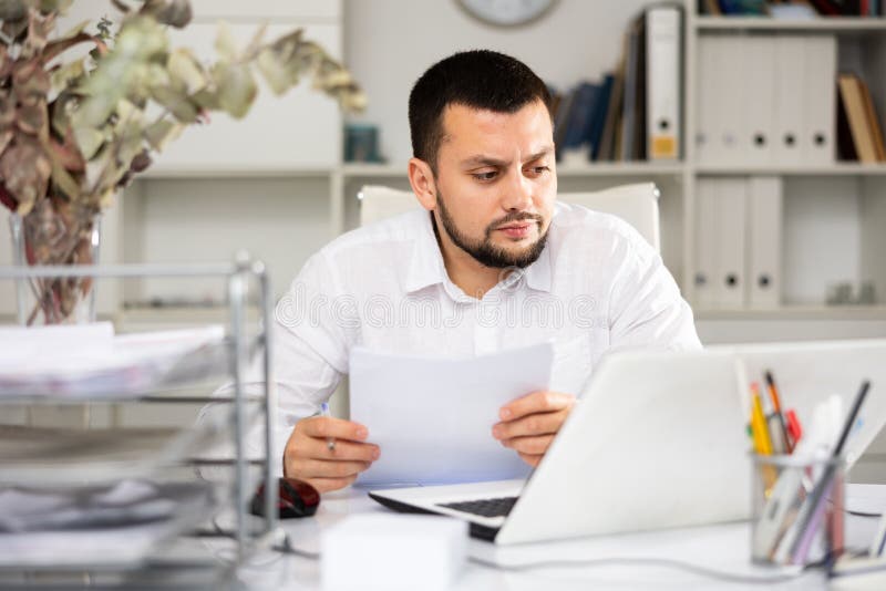 Man Bookkeeper Doing Paperwork in Office Stock Photo - Image of paper ...