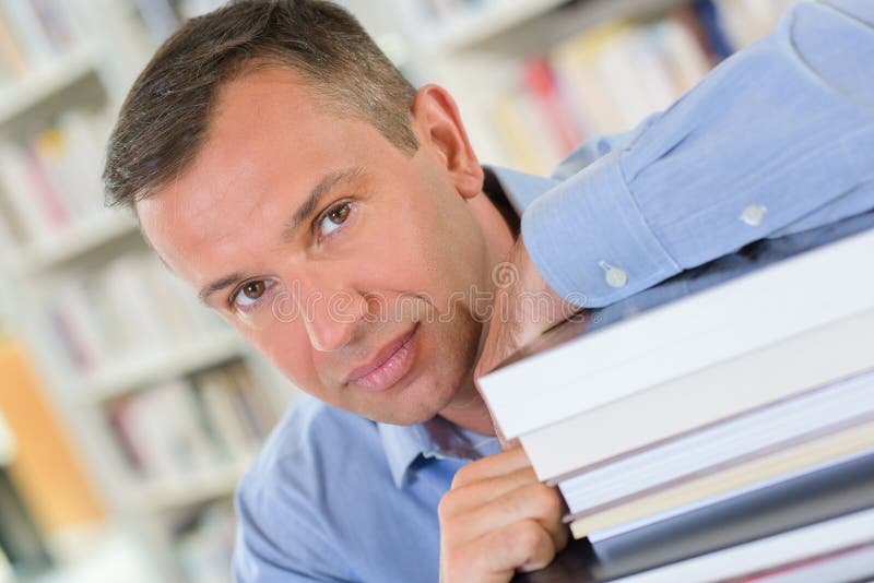 Man with books stock image. Image of educational, publication - 239074183