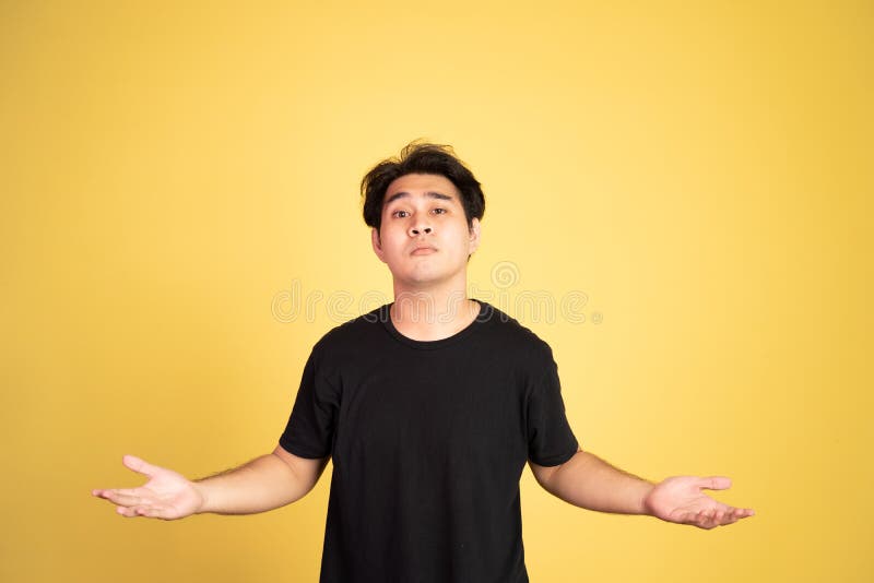 Man with Both Hands Looking Up with a Questioning Expression Stock ...