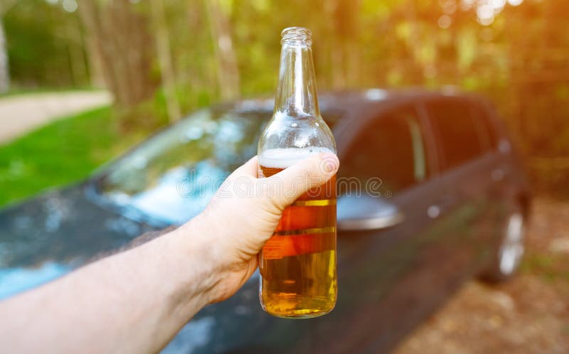 Man with a Bottle of Beer Gets into a Car. Stock Image - Image of abuse ...