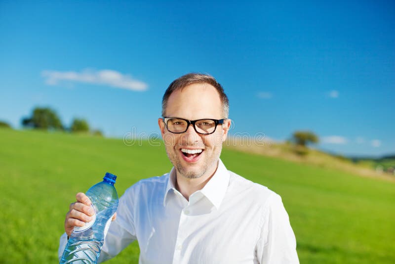 Man drinking bottled water stock photo. Image of refreshing - 31286462