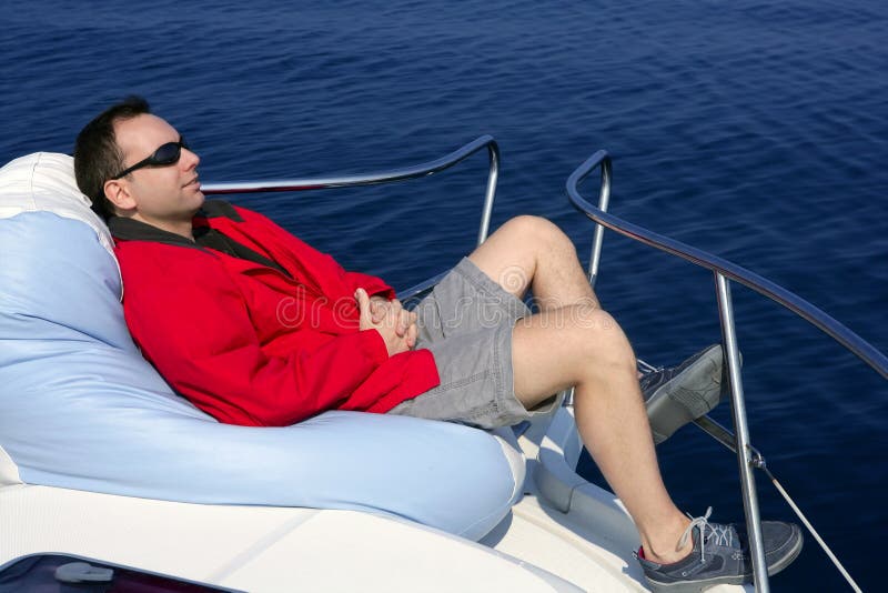 Man on Bow Boat Relaxed on Bean Bag Stock Image - Image of summer, bean ...
