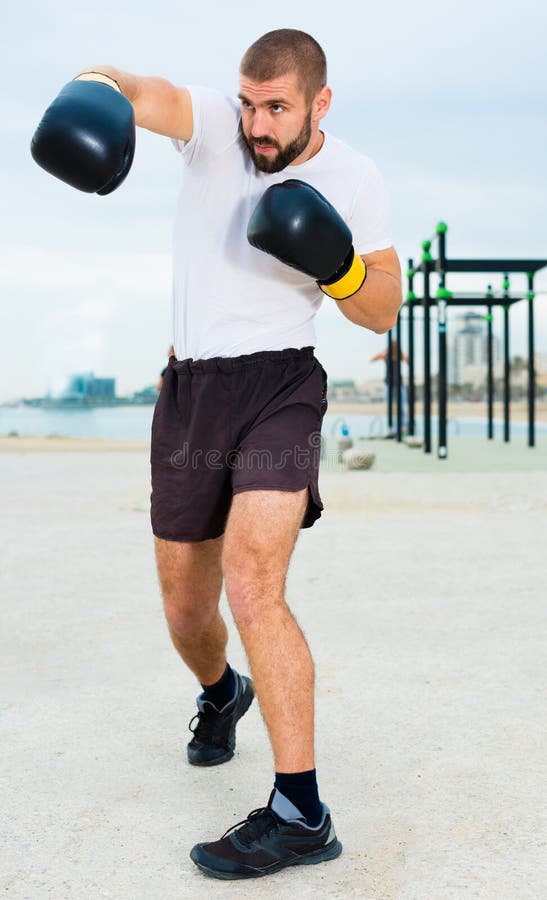 Man in boxing gloves stock photo. Image of adult, athlete - 196379234