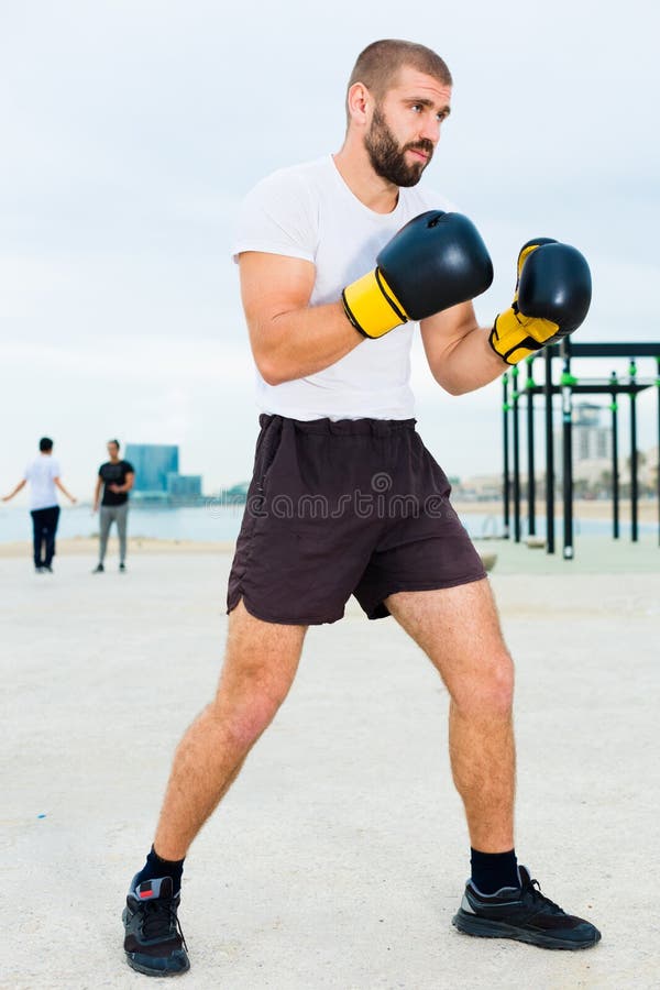 Man in boxing gloves stock photo. Image of famous, kick - 252088958