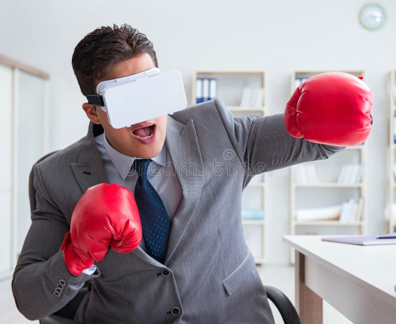 Man Boxing in the Office with Virtual Reality Goggles Stock Photo ...