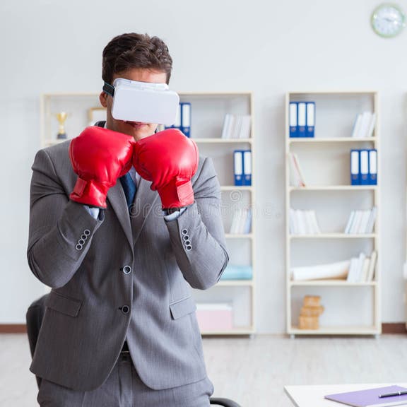 Man Boxing in the Office with Virtual Reality Goggles Stock Photo ...