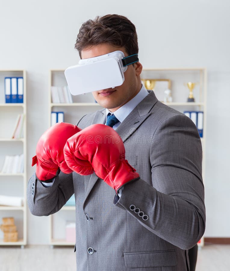 Man Boxing in the Office with Virtual Reality Goggles Stock Photo ...