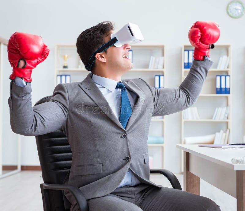 Man Boxing in the Office with Virtual Reality Goggles Stock Photo ...