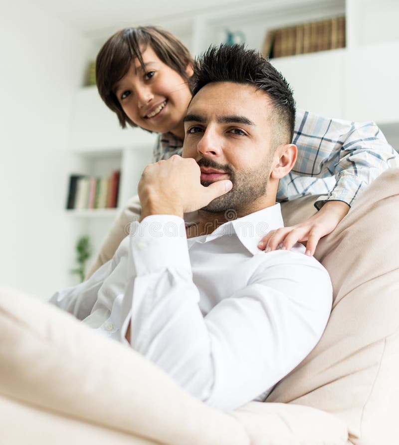 Man and boy stock image. Image of east, cool, interior - 92413235