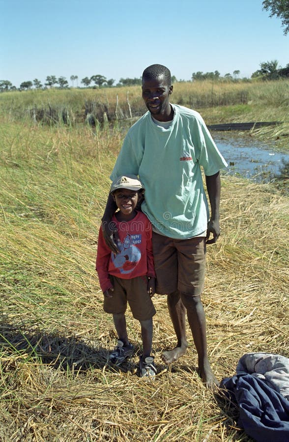 Man and Boy, Okavango Delta, Botswana Editorial Photography - Image of ...