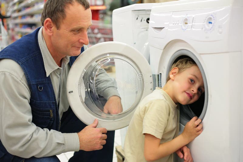 Man and Boy with Washing Machine Stock Image - Image of purchase, human ...
