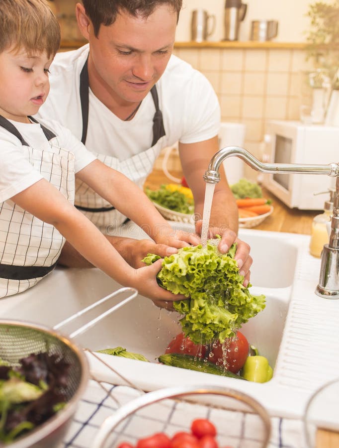 Man and Boy Washing Vegetables before Eating Stock Image - Image of ...