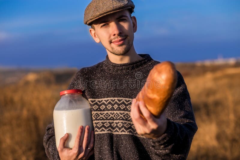 Man with Bread and Milk in a Field Stock Image - Image of food, fresh ...